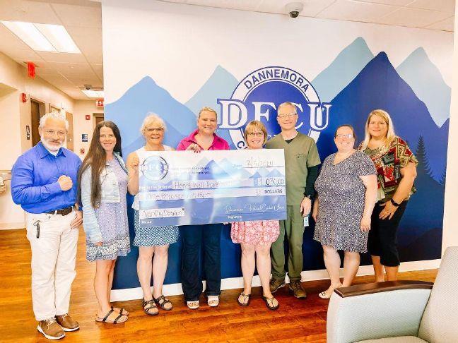 DFCU employees raise $1K+ for Heart Well Homestead | Sun Community News ...